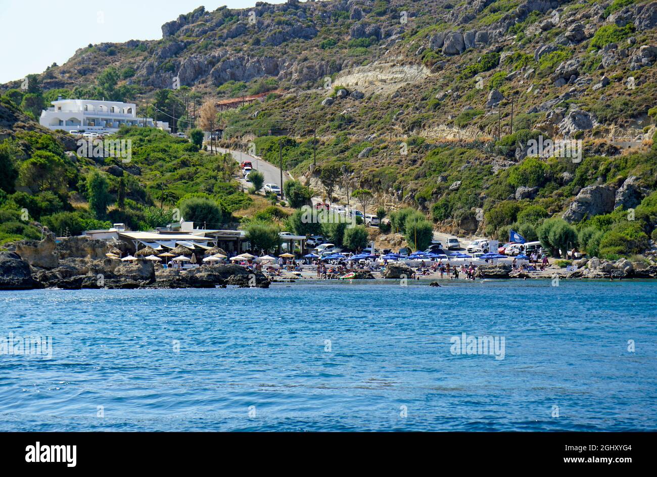 natural beach of ladiko bay in greece Stock Photo - Alamy