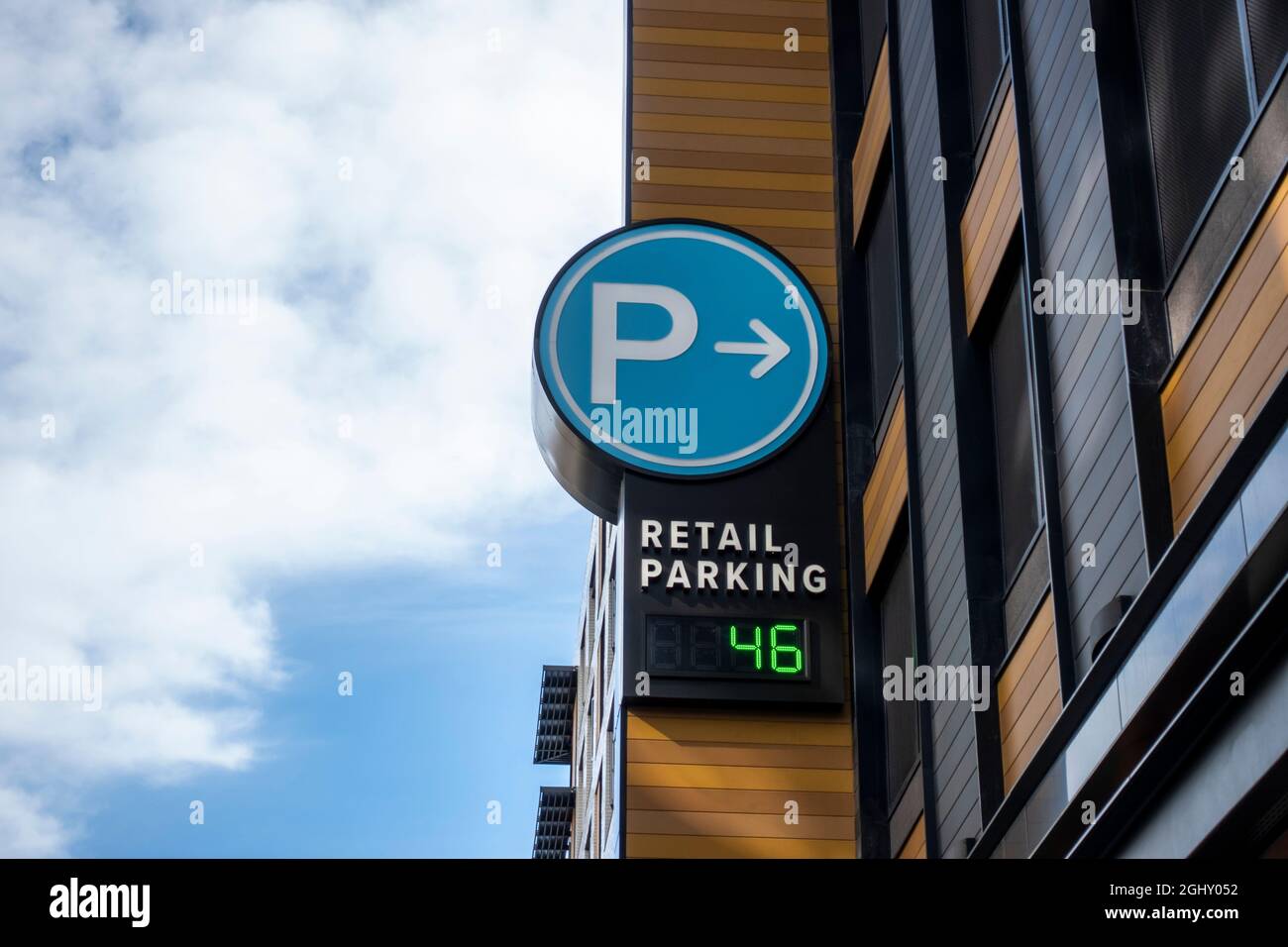 Low angle view of a baby blue digital parking sign for a parking garage ...