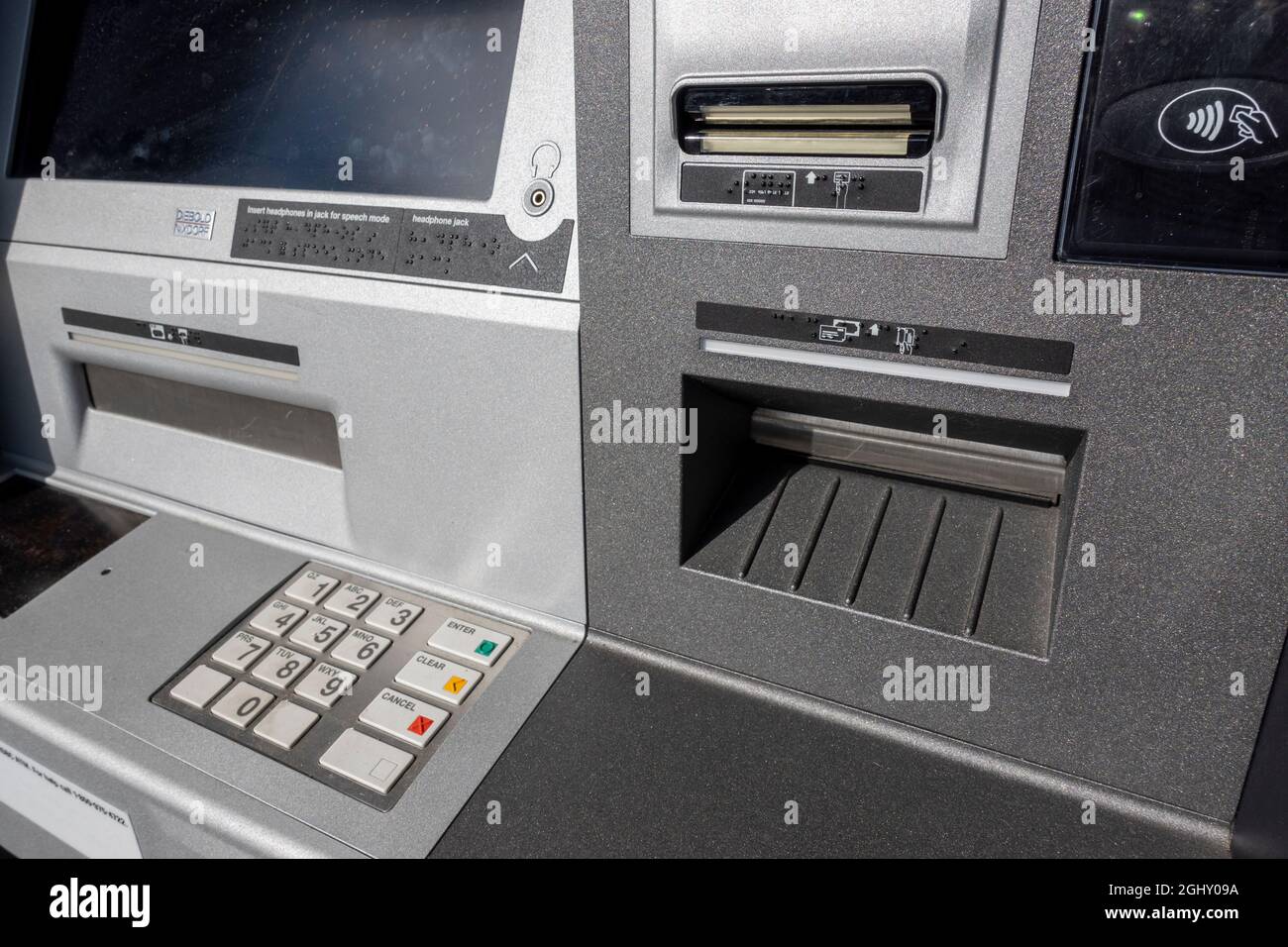 Angled view of an ATM number pin pad and check deposit slot at an ...
