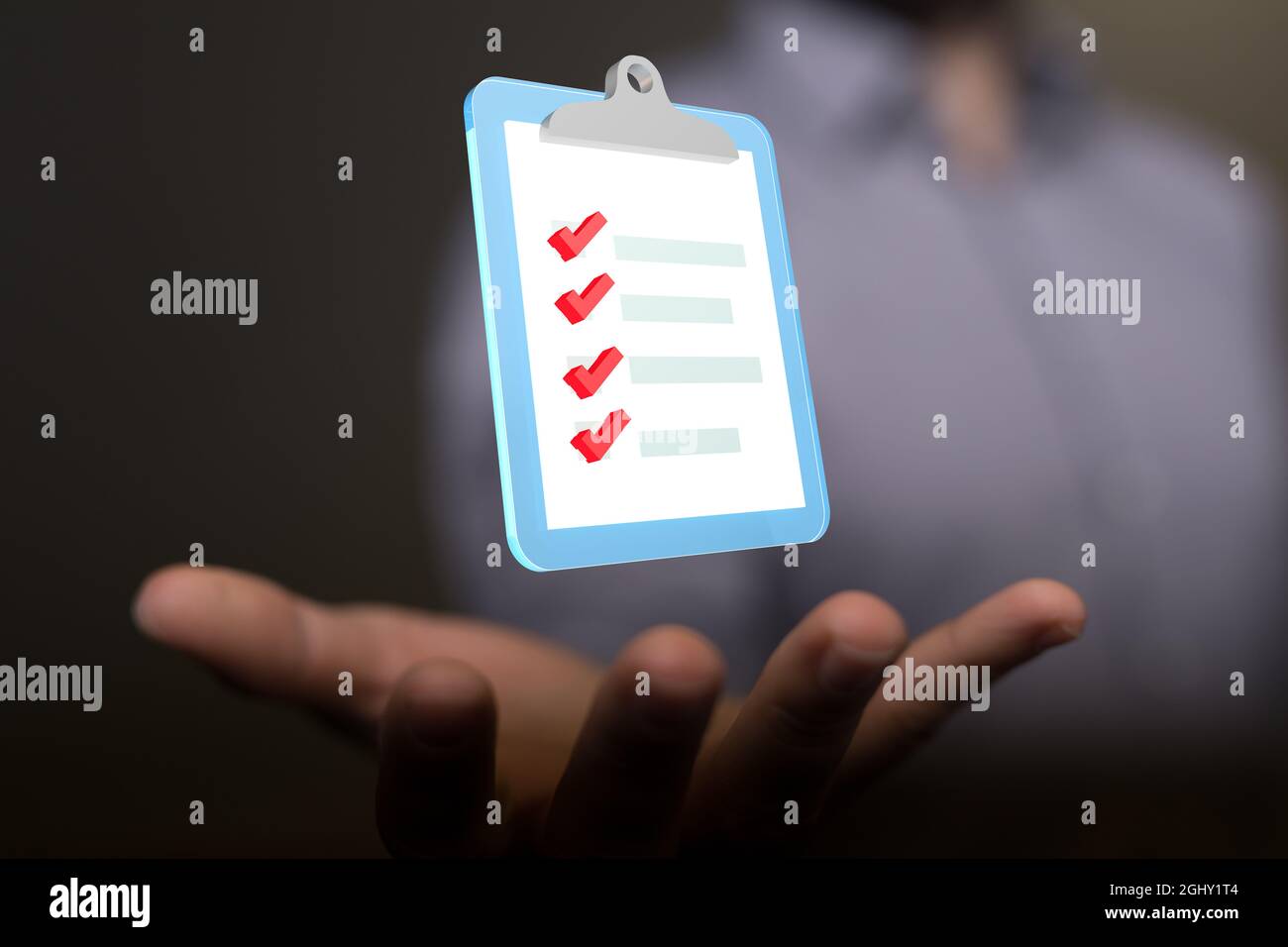 3D rendered checklist hovering over a man's hand Stock Photo - Alamy