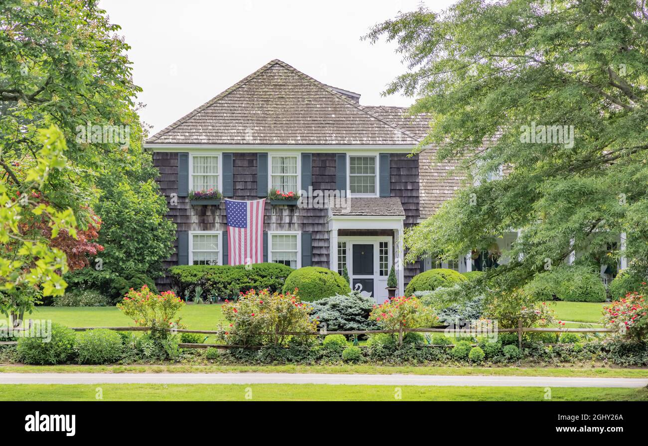 American flag front of house hi-res stock photography and images - Alamy