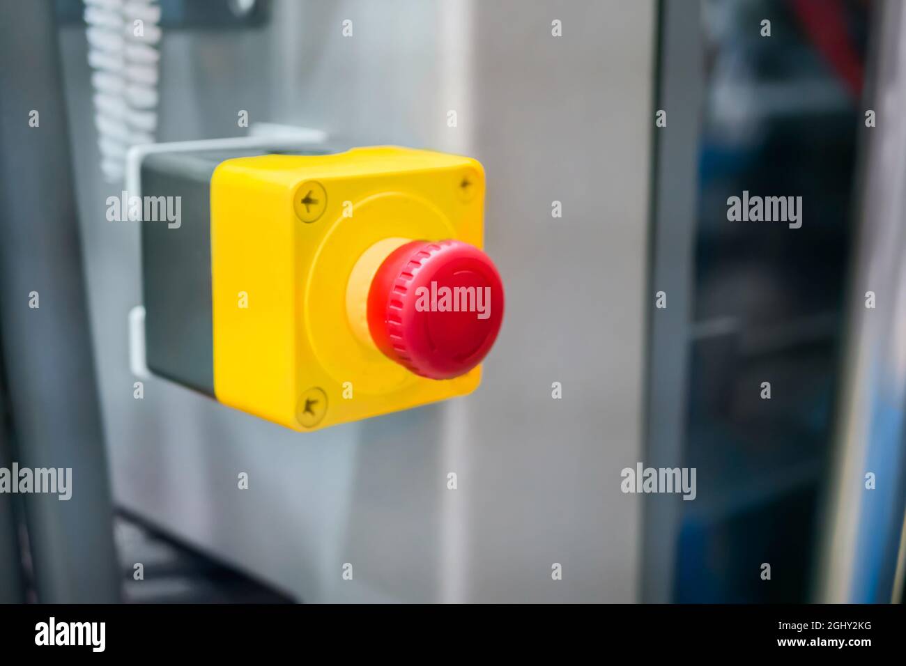 Close up view: machine control panel with red switch button - emergency ...
