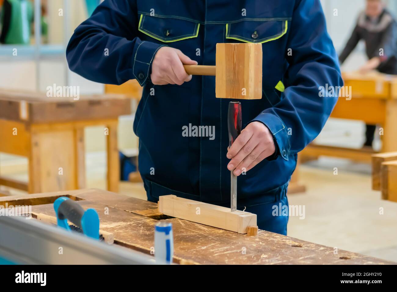 Carpenter using chisel and hammer to carve wood - close up Stock Photo ...