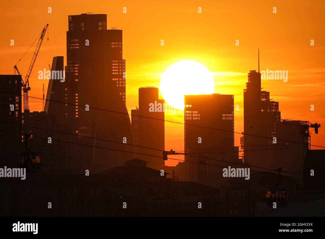 Sun sets behind City of London skyscrapers, London, England, United ...