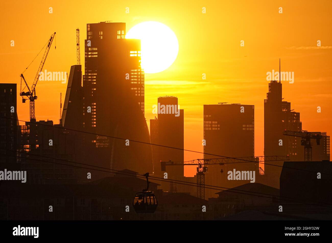 Sun sets behind City of London skyscrapers, London, England, United ...