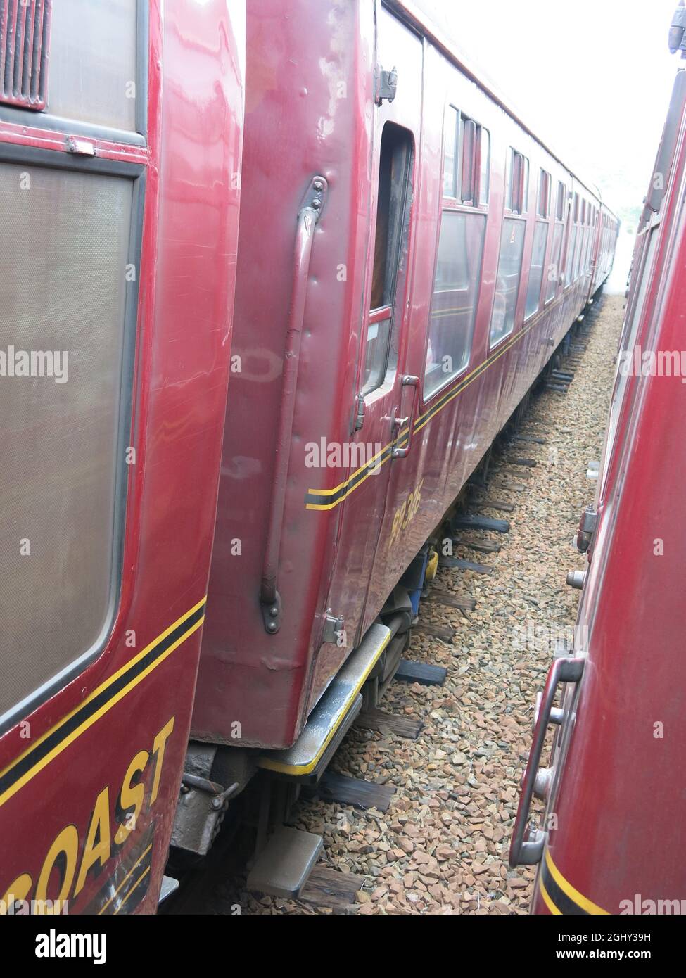 The red carriages of two Jacobite steam trains pass each other on the ...
