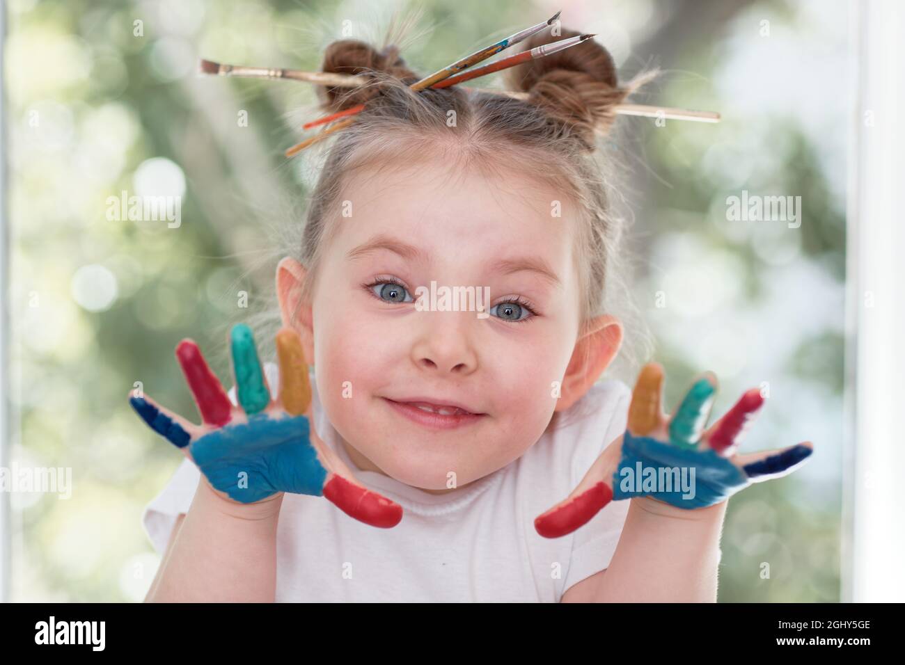 girl showing painted hands Stock Photo - Alamy