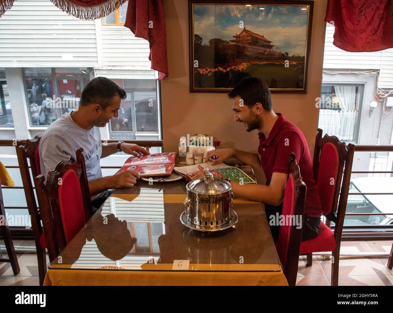 Istanbul, Turkey. 2nd Sep, 2021. Turkish customers look at menus at a ...