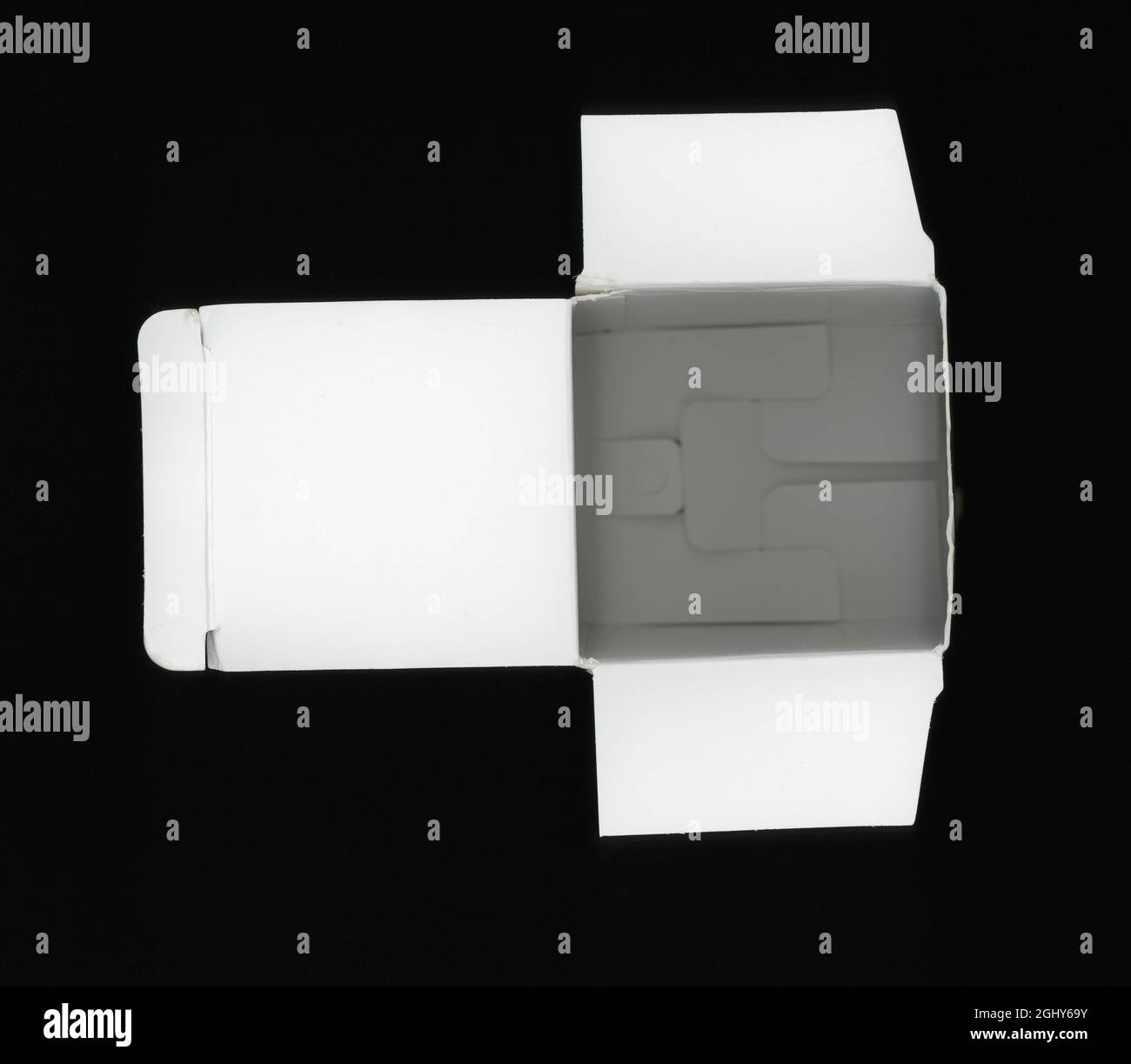 empty open cardboard box over black background Stock Photo - Alamy