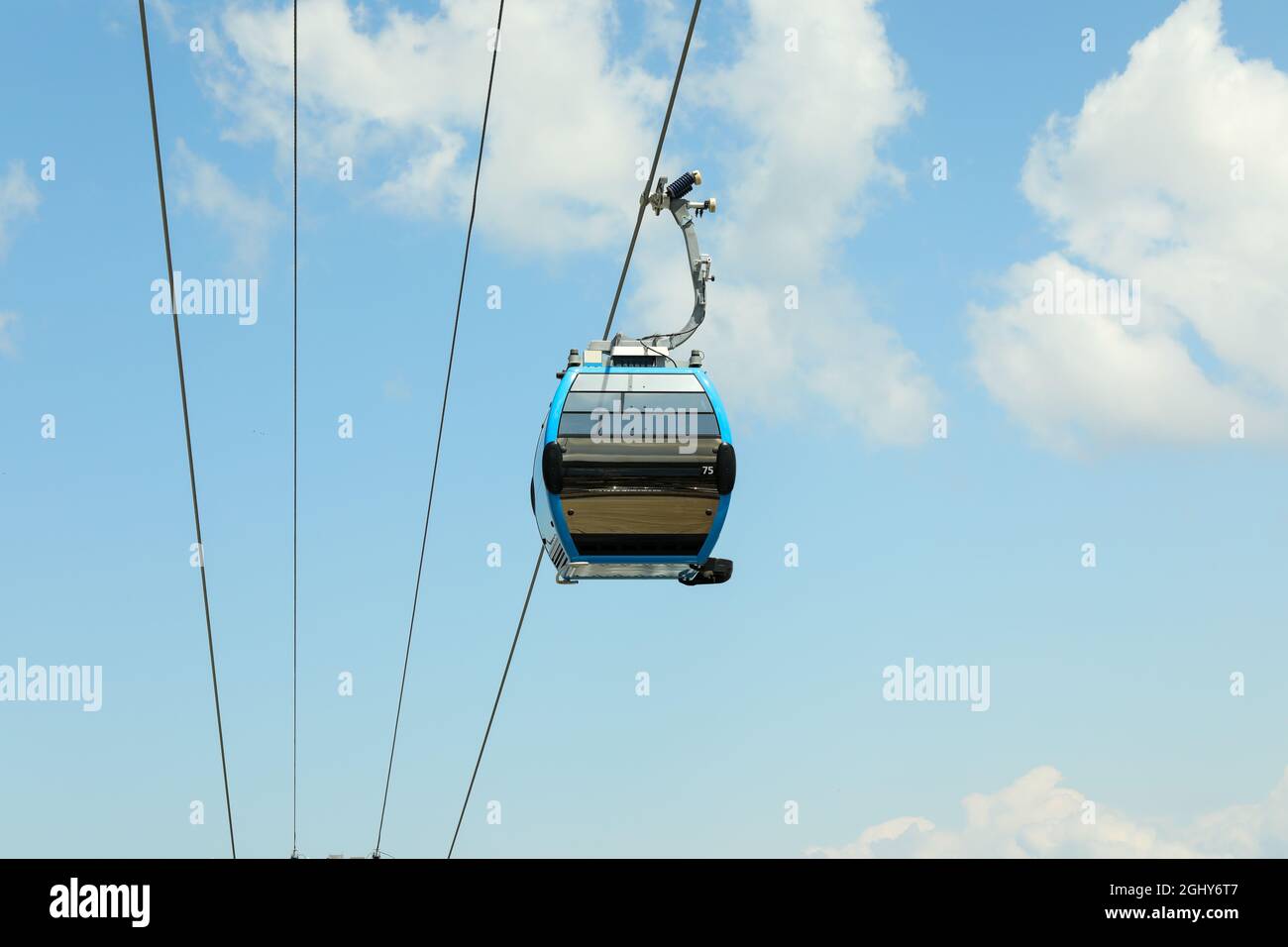 Cable car cabins against amazing sky and clouds. Cableway Stock Photo ...