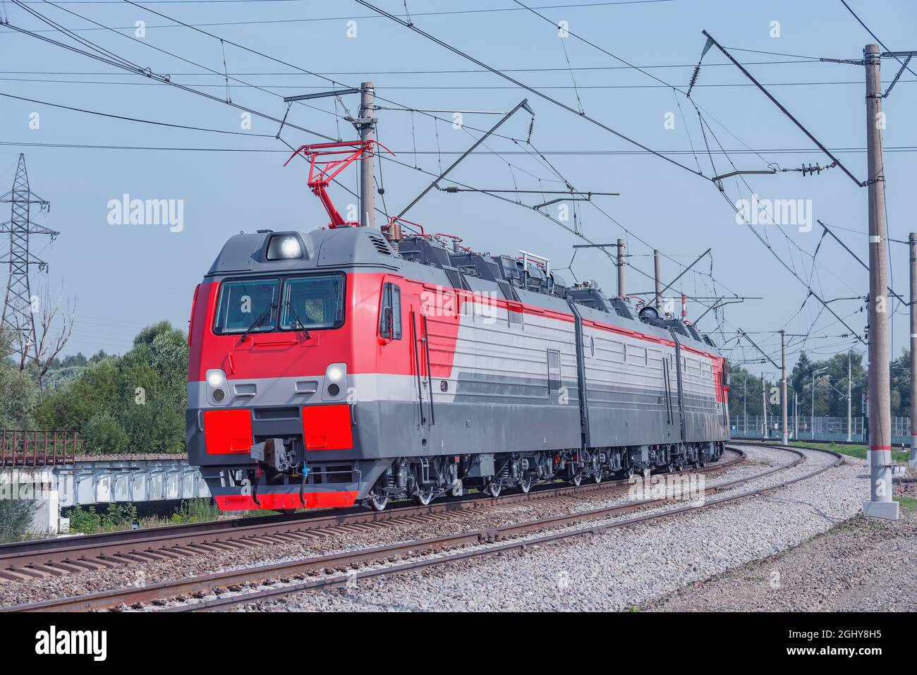 Freight modern electric locomotive approches to the station Stock Photo ...