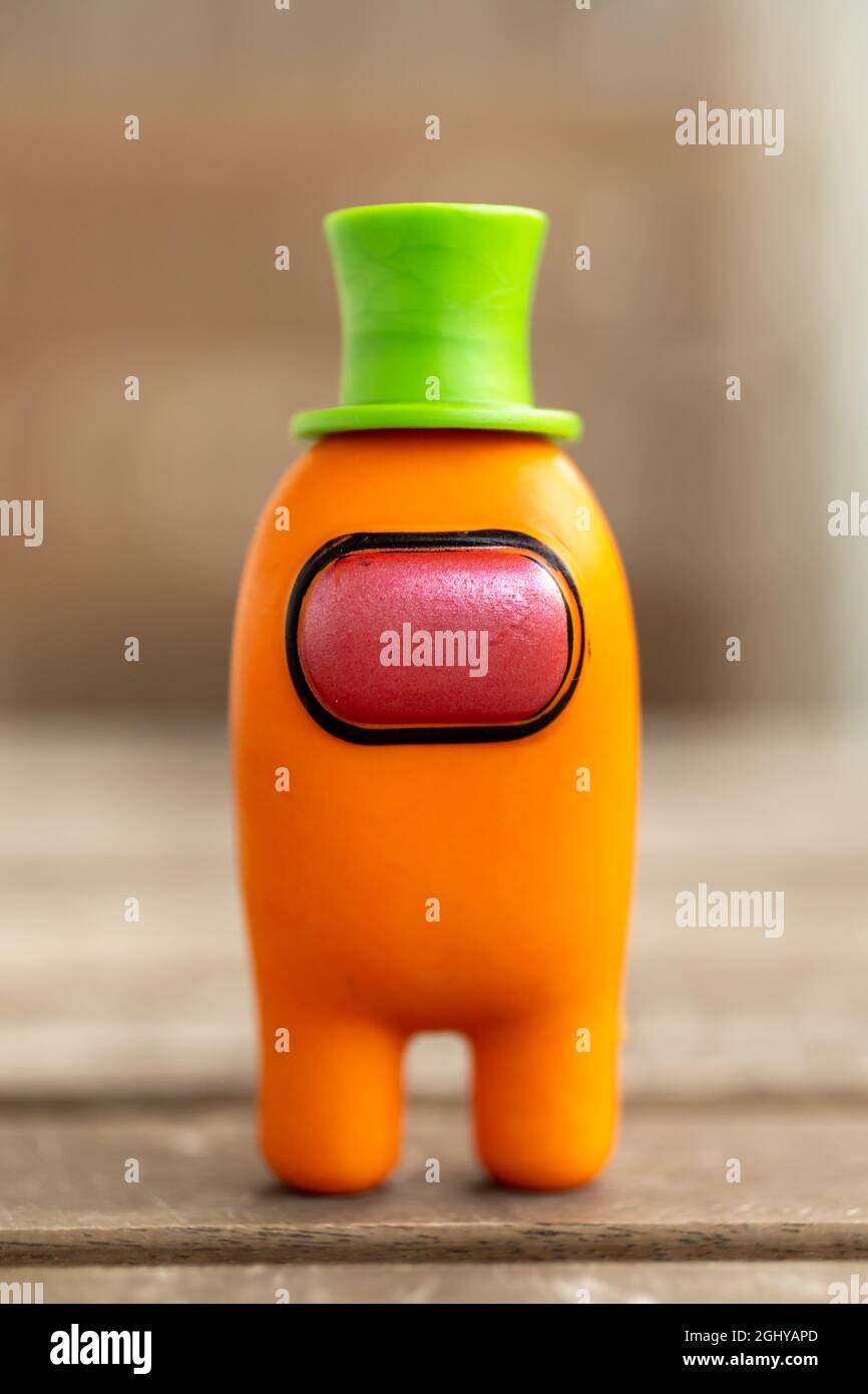 POZNAN, POLAND - Aug 15, 2021: An orange plastic "Among Us" crewmate ...