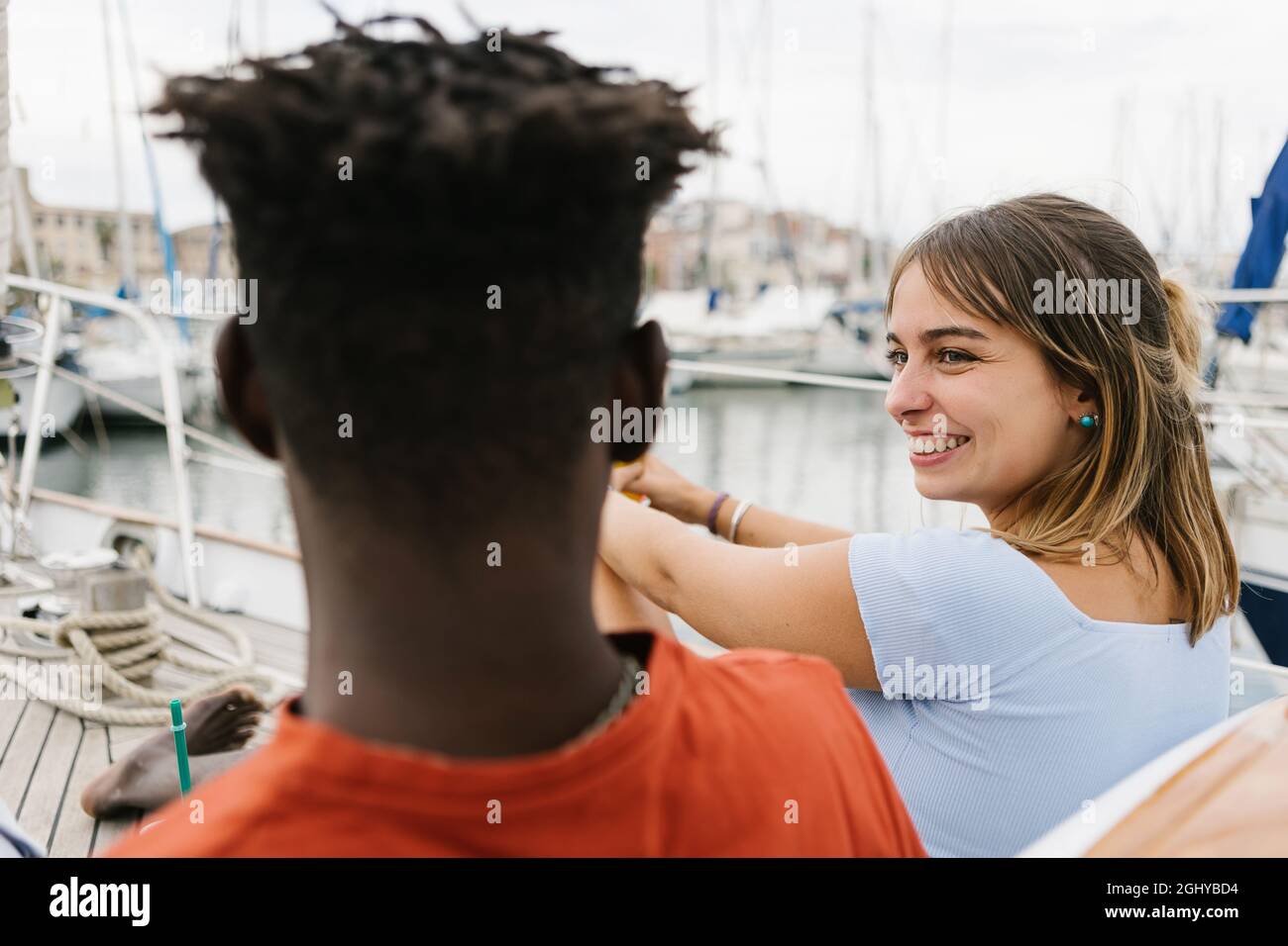 Multicultural millennial friends laughing and having fun outdoors Stock ...