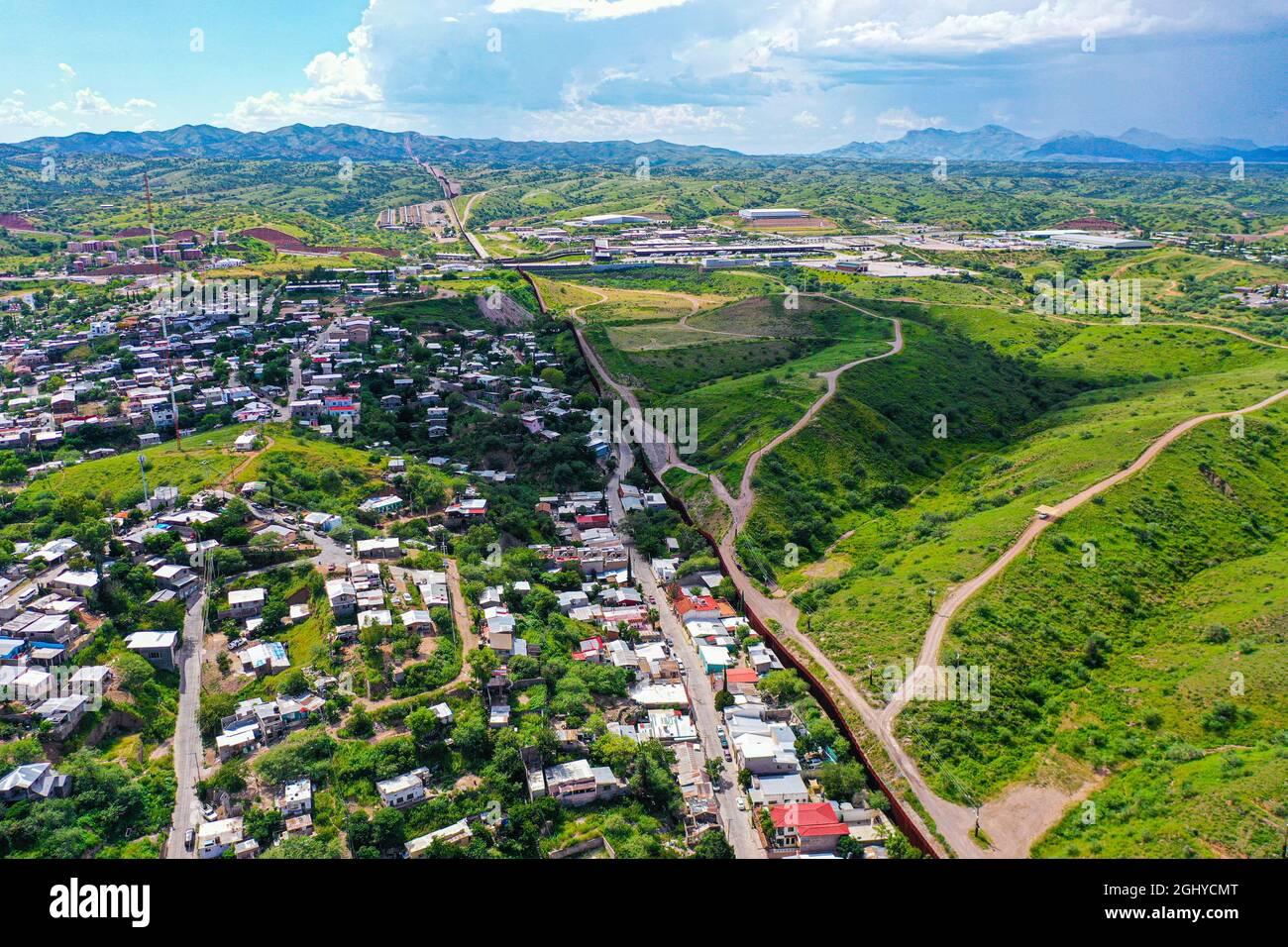 Aerial view of the border wall in Nogales Sonora (L) in Mexico and ...
