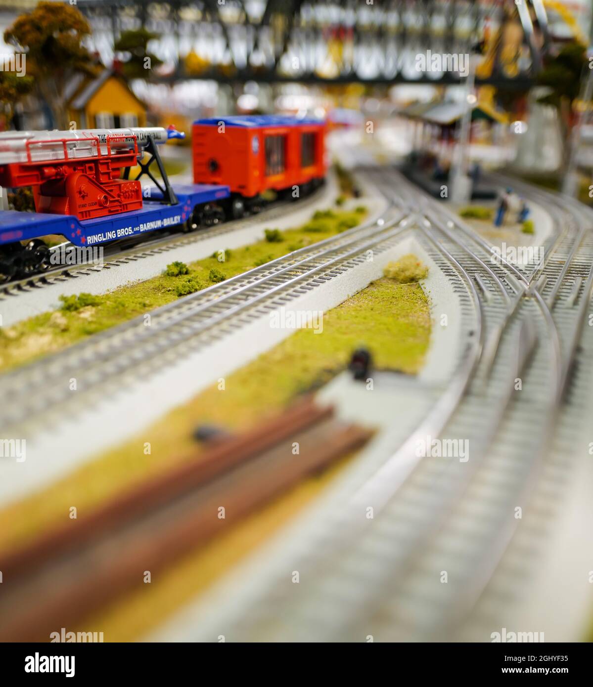 close up of tracks, town, buildings and people on toy train set Stock ...