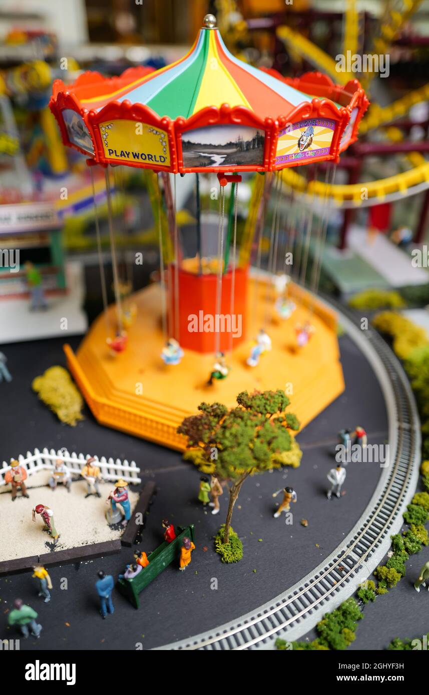 close up of tracks, town, buildings and people on toy train set Stock ...