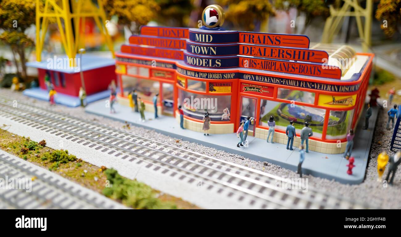 close up of tracks, town, buildings and people on toy train set Stock ...