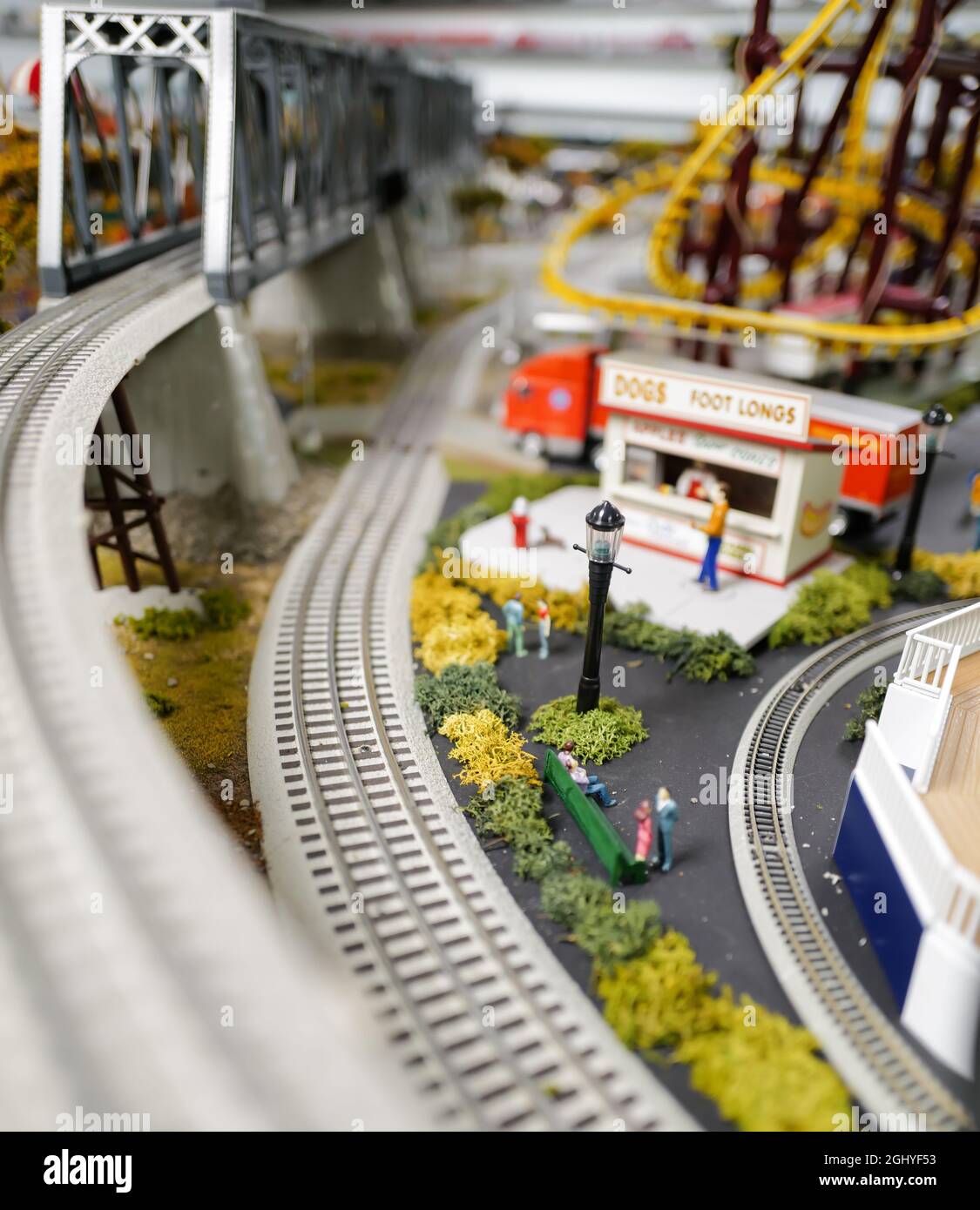 close up of tracks, town, buildings and people on toy train set Stock ...