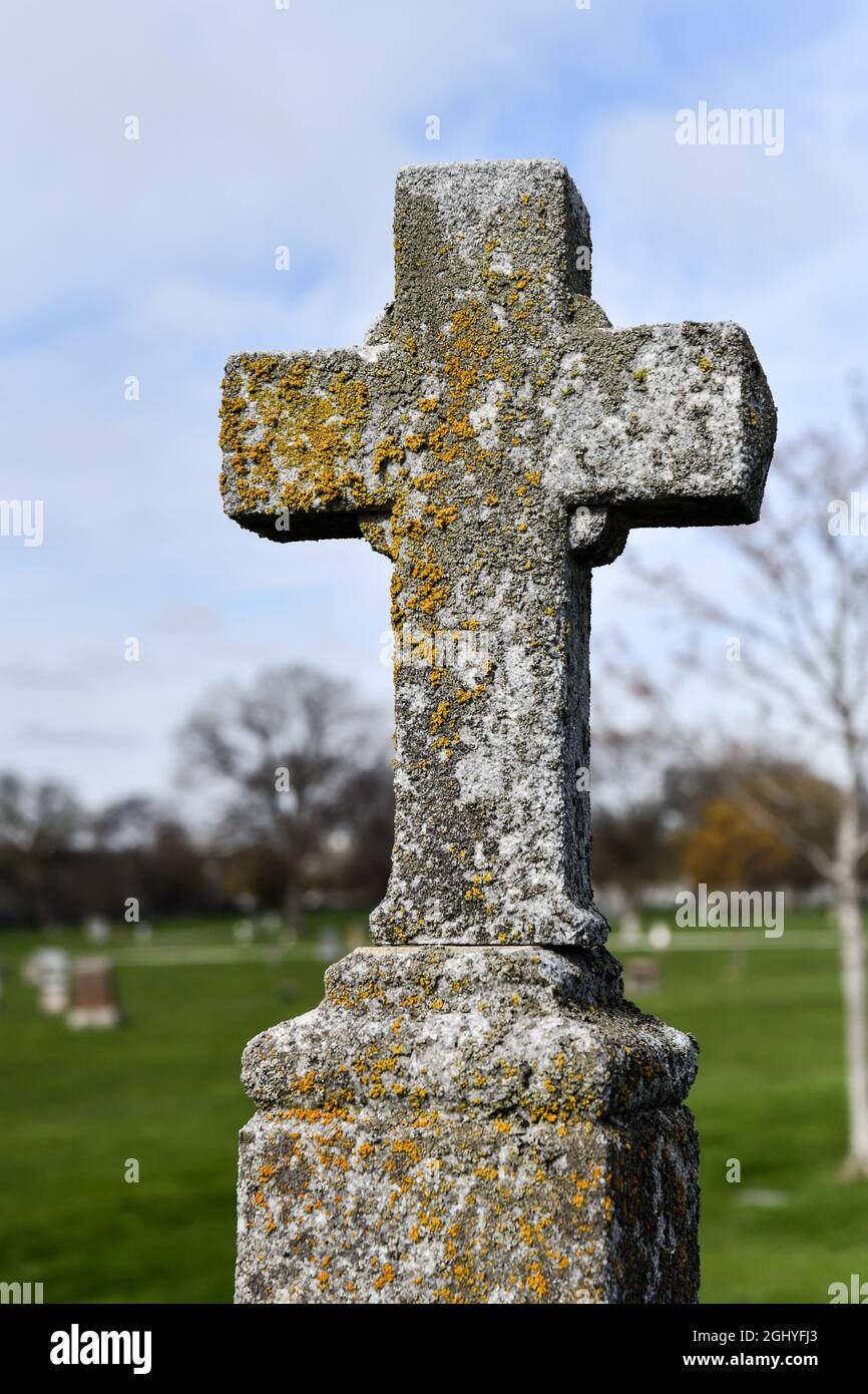 cemetery grave cross and statue Stock Photo - Alamy