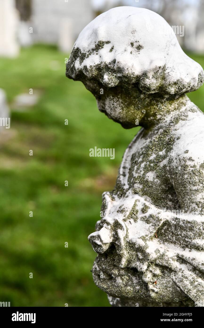 cemetery grave cross and statue Stock Photo - Alamy