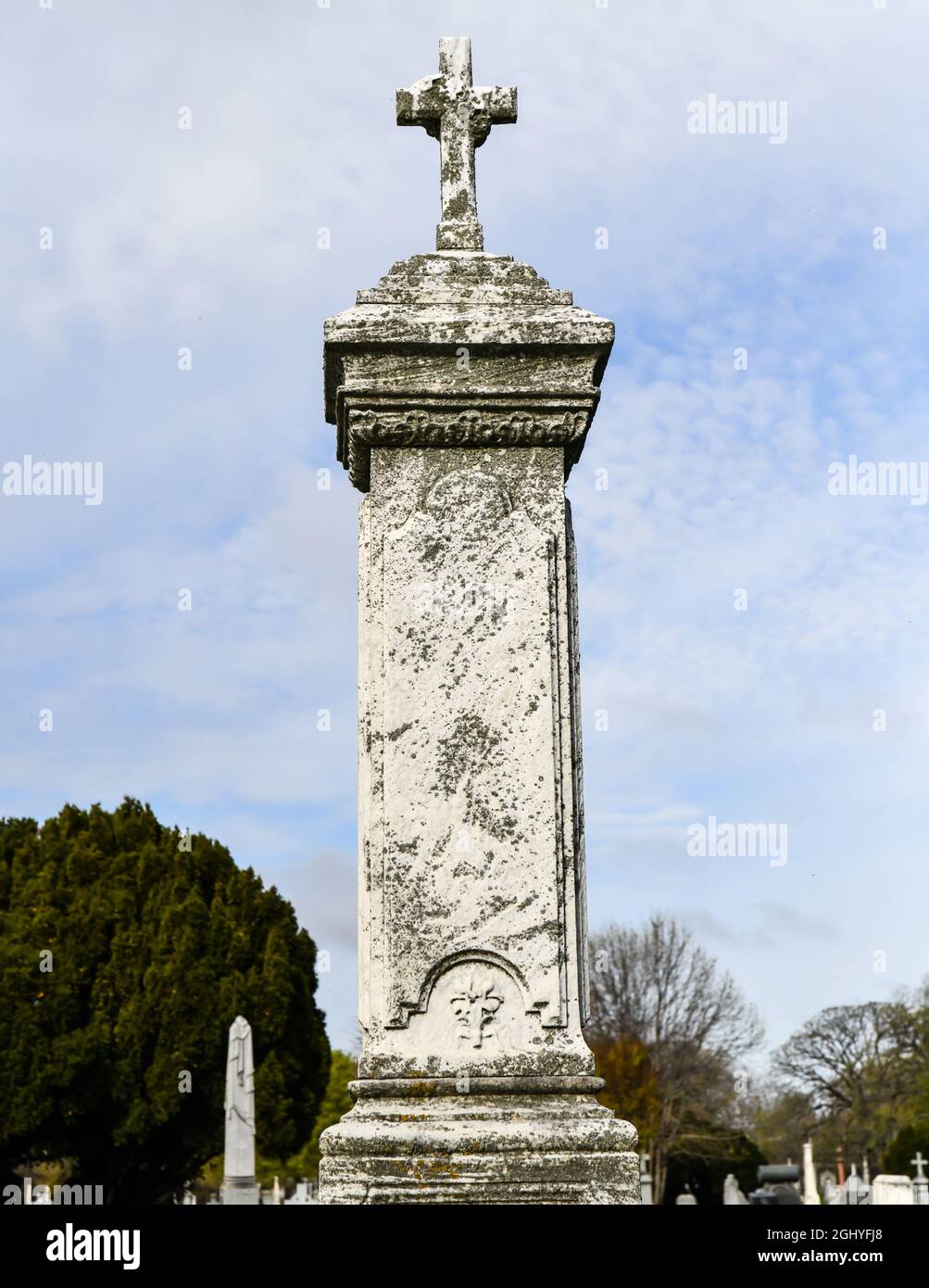 cemetery grave cross and statue Stock Photo - Alamy