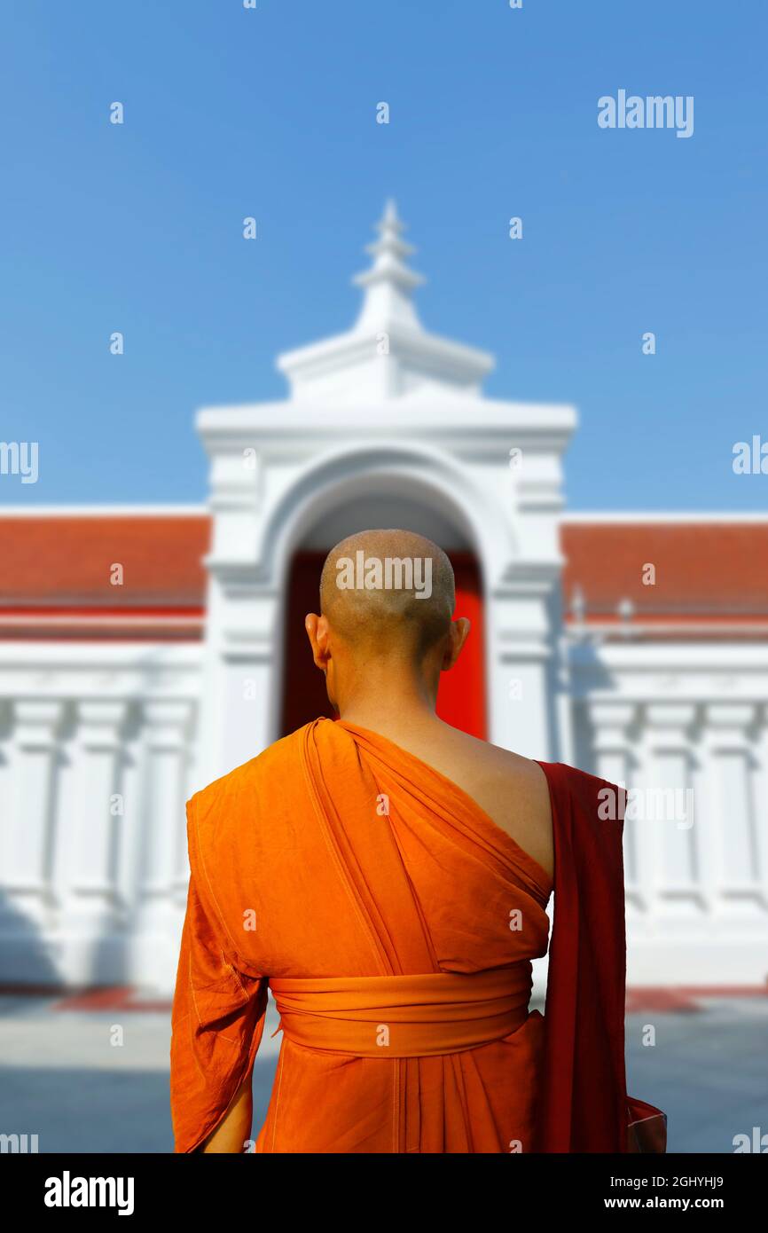 MONK WEARING ORANGE ROBE COMING IN BUDDHIST TEMPLE Stock Photo - Alamy