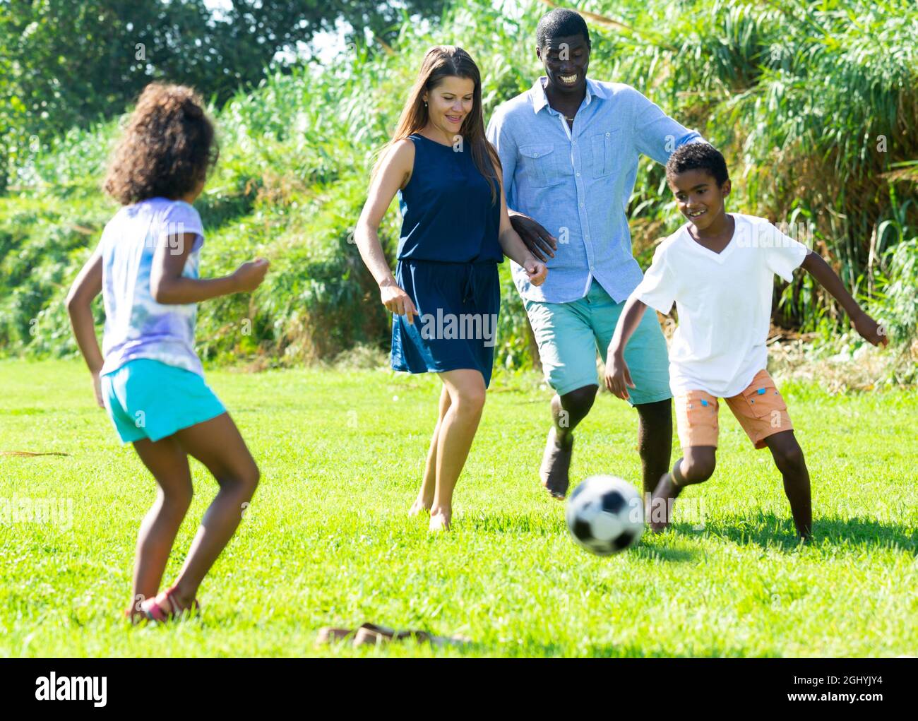 Family playing ball Stock Photo - Alamy