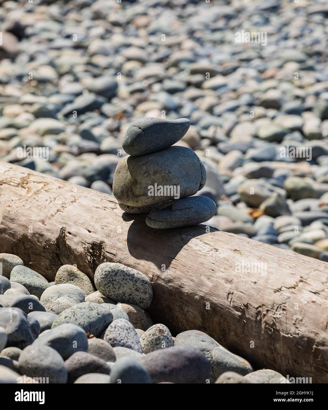 pile of balanced round stones on the beach. Street view, travel photo ...