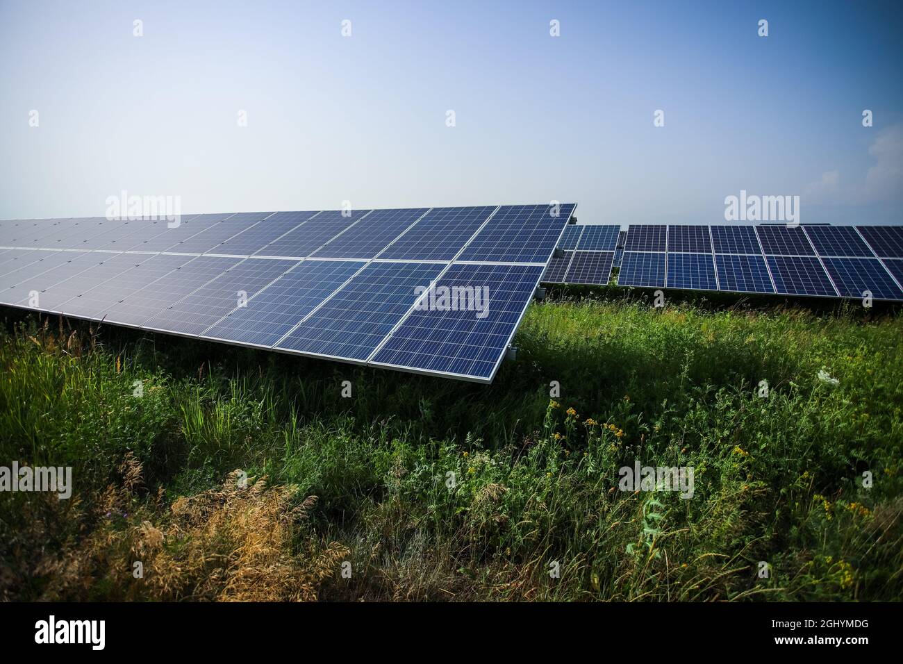A sun's rays fall beautifully on solar panels Stock Photo - Alamy