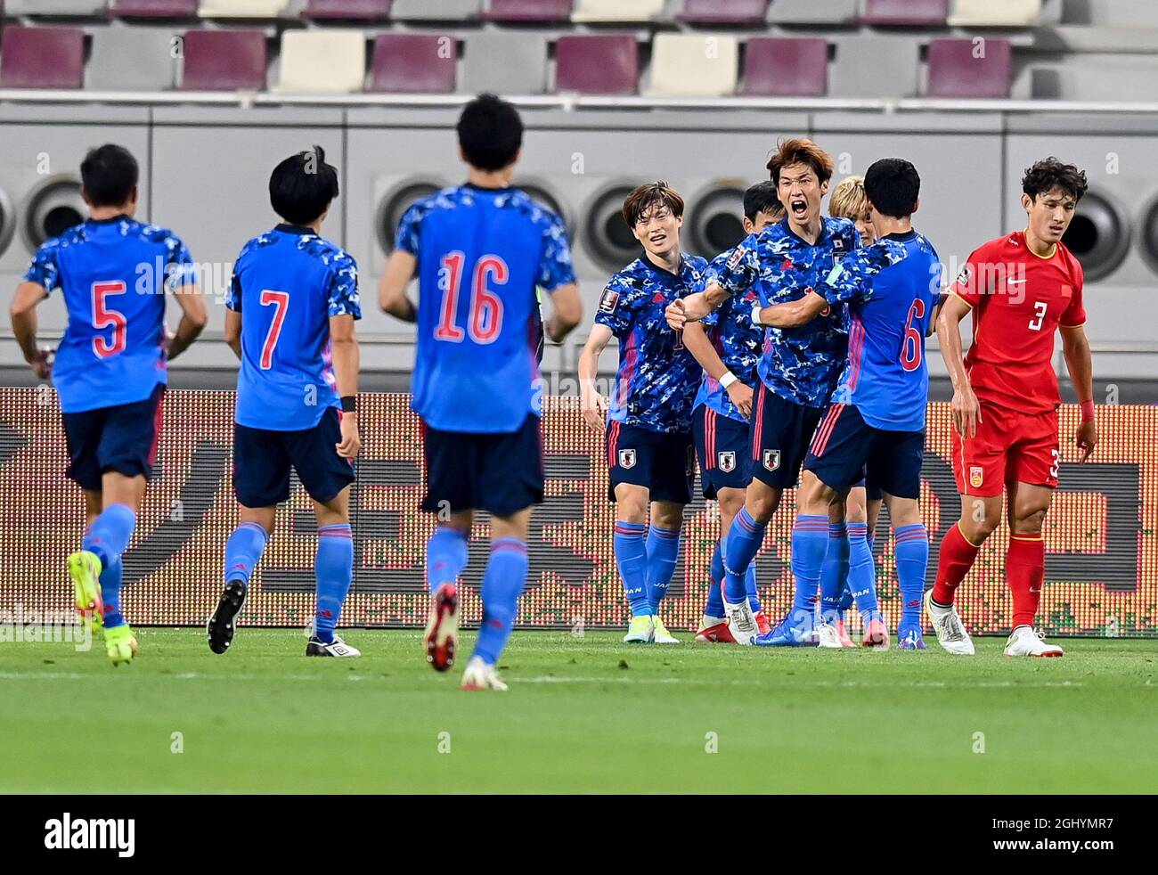 Doha, Qatar. 7th Sep, 2021. Osako Yuya (4th R) of Japan celebrates ...
