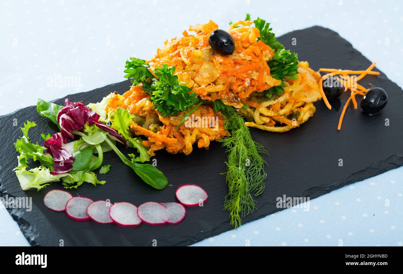Tempura vegetables with greens, radish, black olives Stock Photo - Alamy