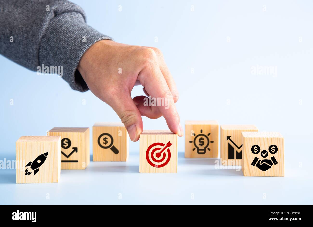 Business strategy, business management or business success concept. Hand arranging wooden blocks ...