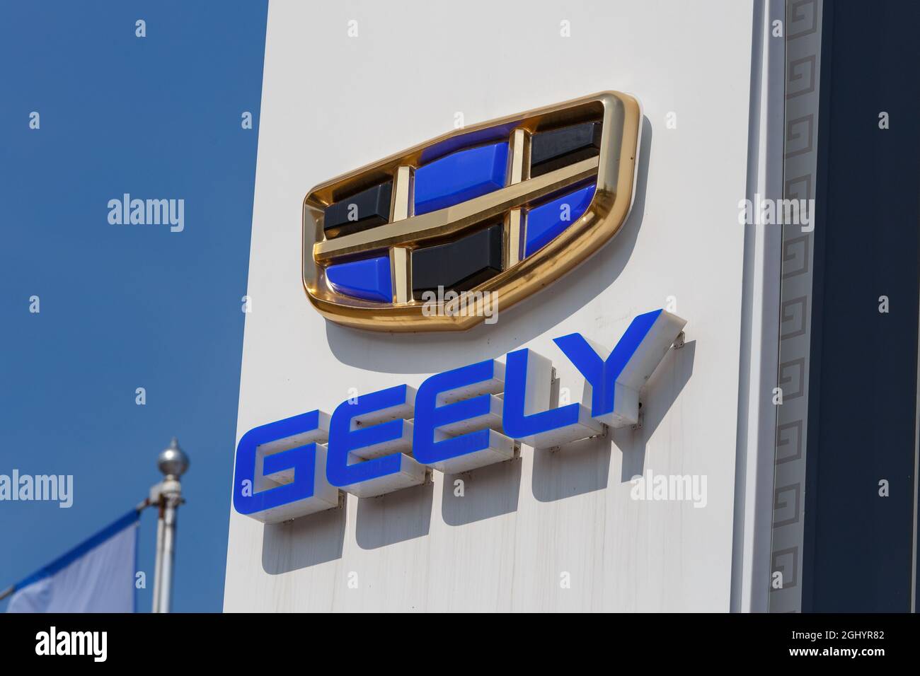 Geely logo on car dealership pillar at sunny day - Geely is one of the ...