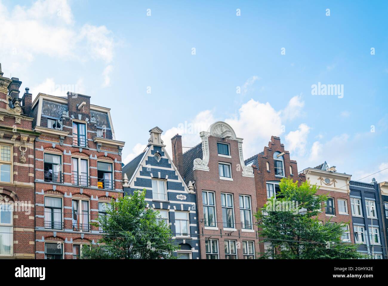 Row of typically Dutch canal houses with their variety and diversity of ...