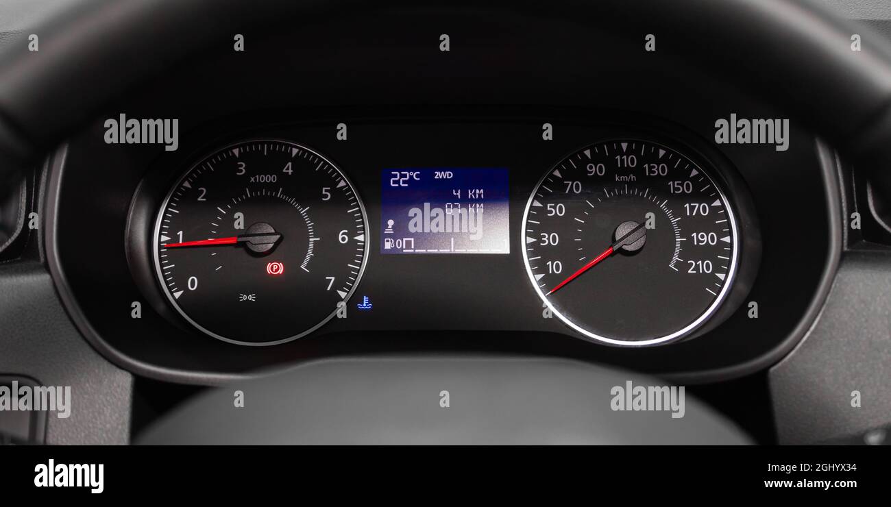 dashboard of the car is illuminated by bright illumination. Speedometer ...