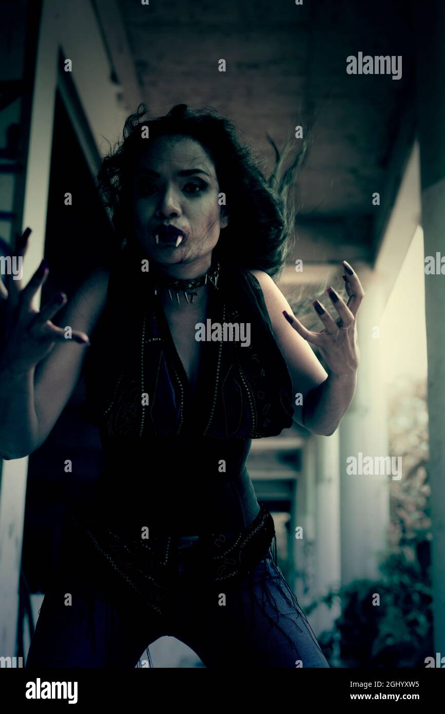 Blurry Vampires Woman in upset moody with bloody lips.Hunting prey in ...