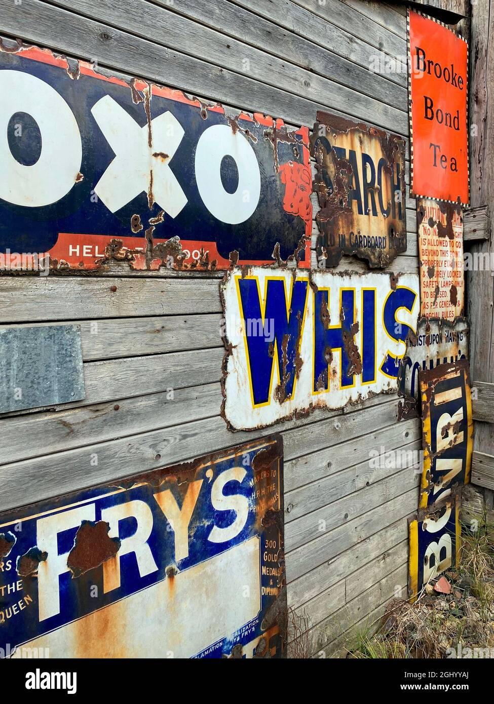 Old metal advertising signs used to line the exterior of a garden shed ...