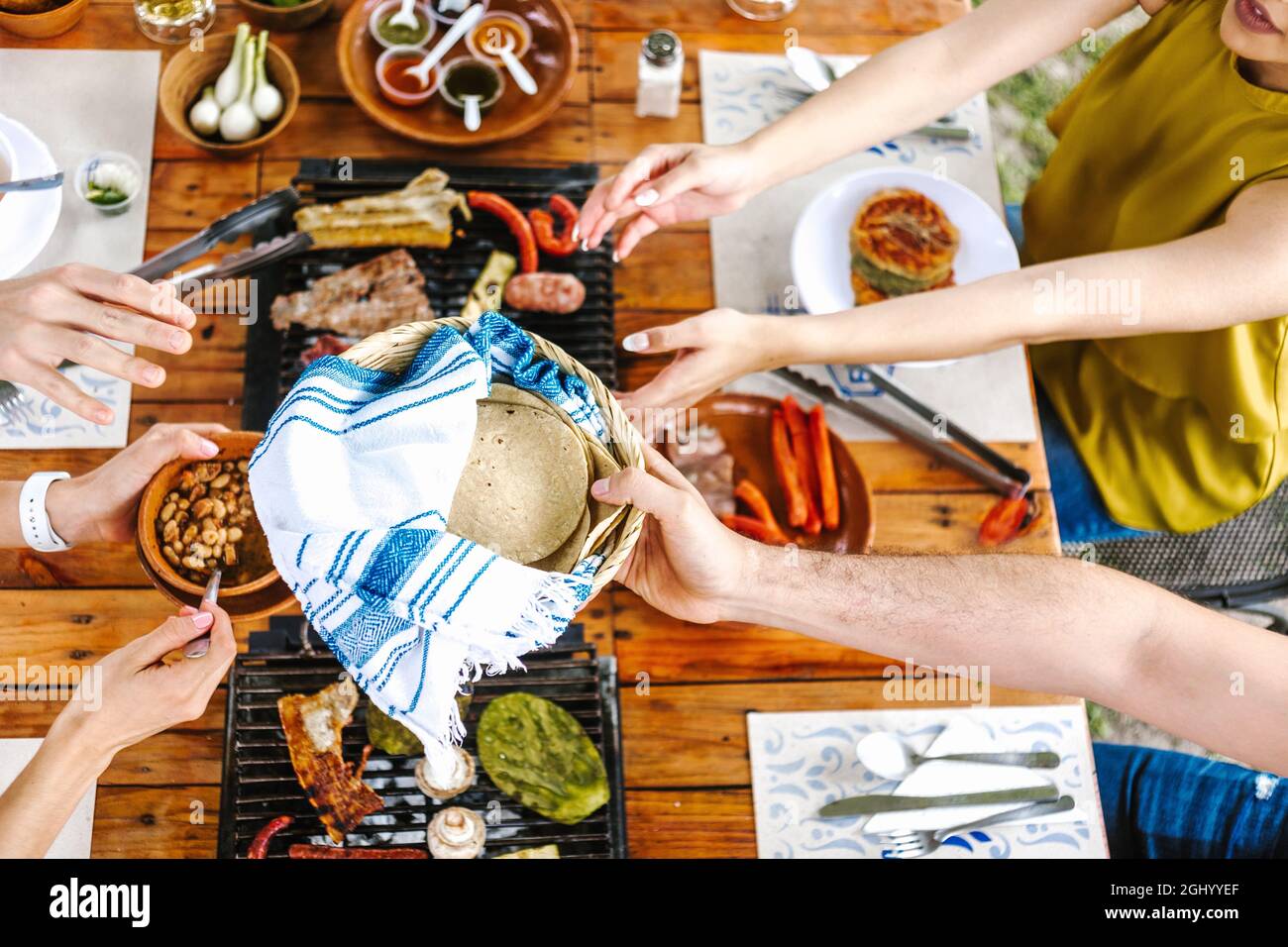group of Friend eating Mexican Tacos and traditional food, snacks and ...