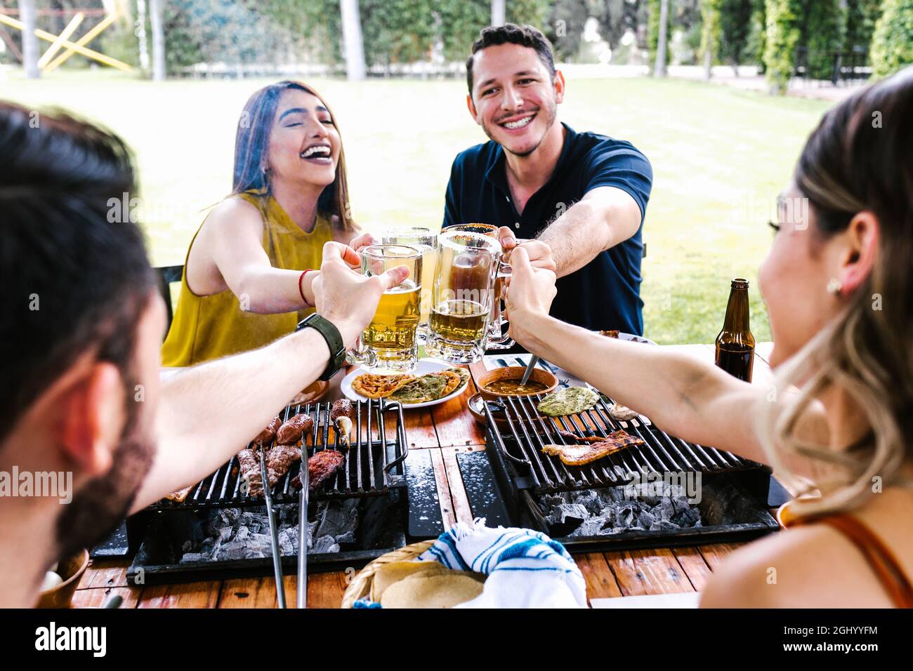Group of Young latin Friends Meeting For beer, michelada Drinks And ...