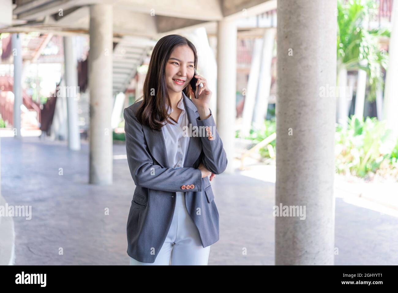 Working woman concept a working woman with smiley face speaking on the ...
