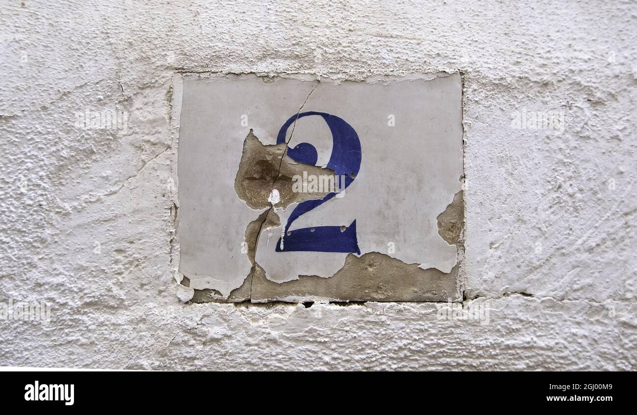 Detail of number stop on a wall, information and address Stock Photo ...