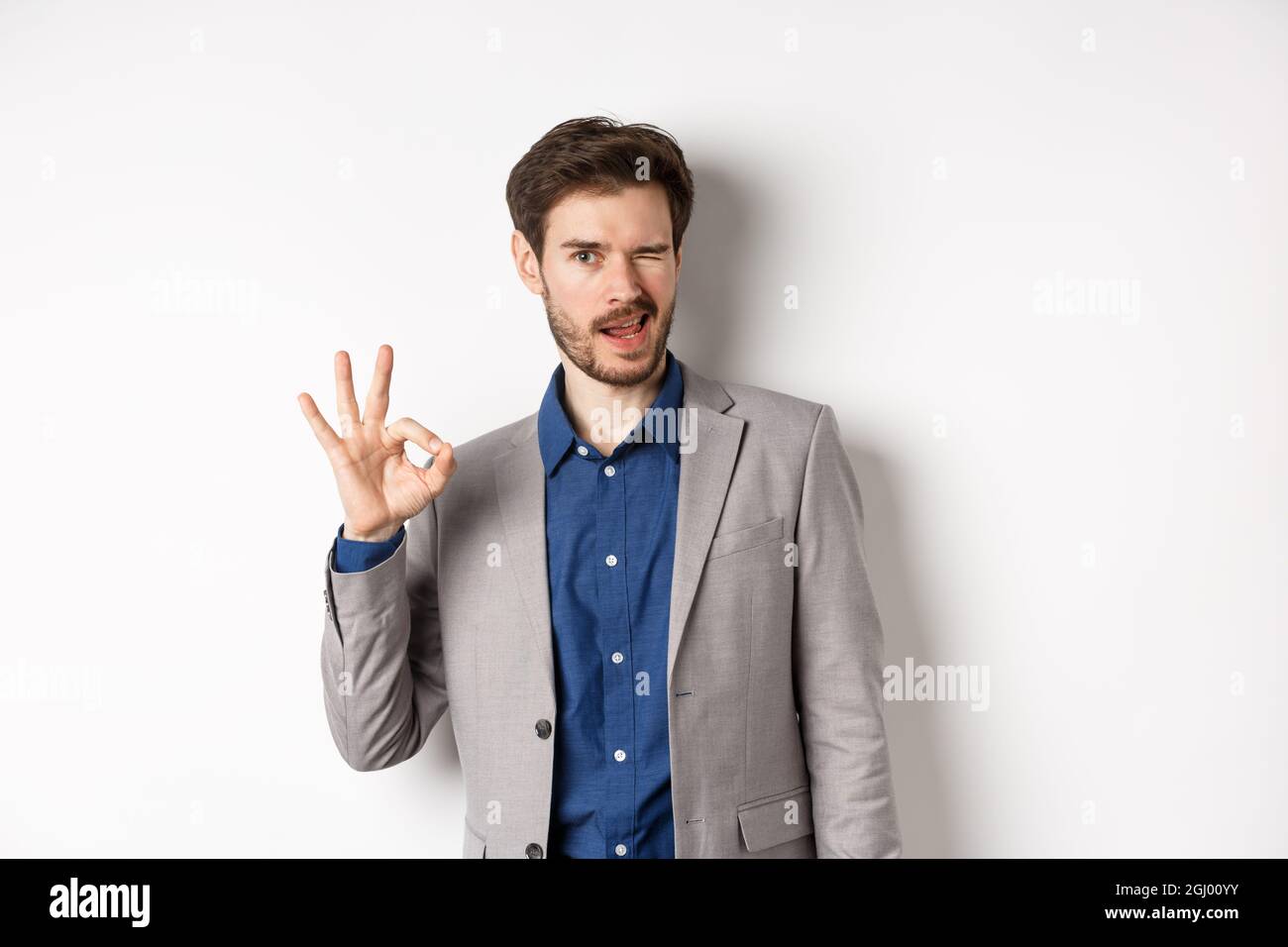 All good. Confident male ceo manager showing okay sign and winking ...