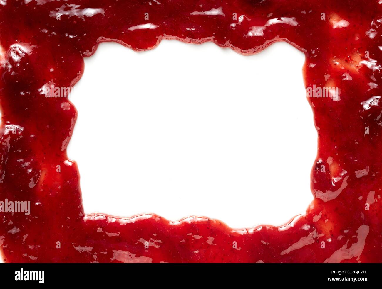 Frame formed of colorful red strawberry jam on white around a central ...
