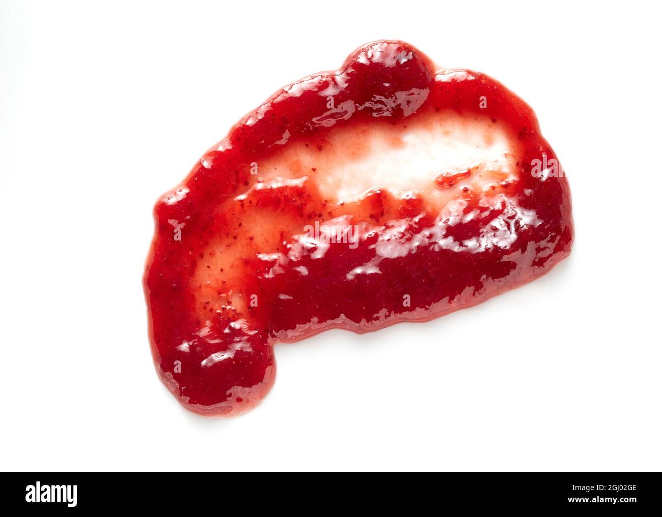 Random shaped blob of tasty homemade strawberry or raspberry jam in a ...