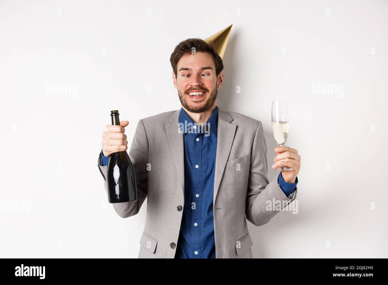 Celebration and holidays concept. Funny drunk guy in suit and birthday ...