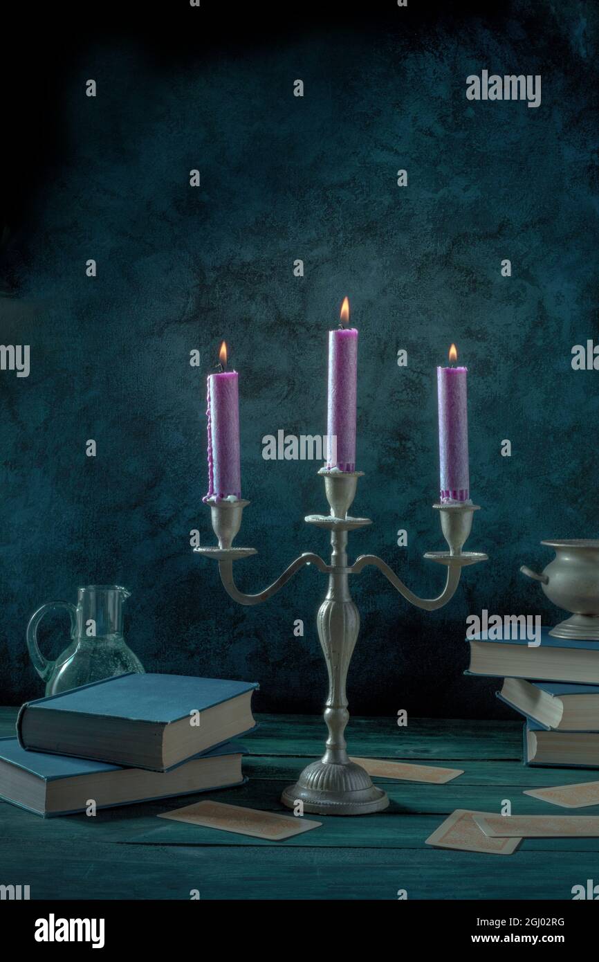 Magic and divination. Candles and old books, magic potion, divination ...