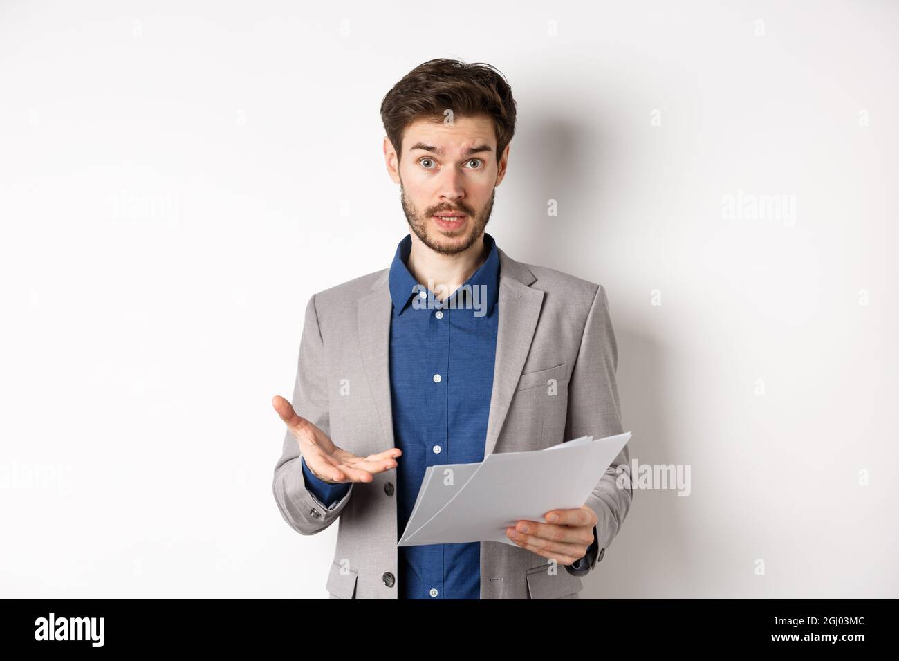 Confused businessman looking at bad document, complaining on deal ...