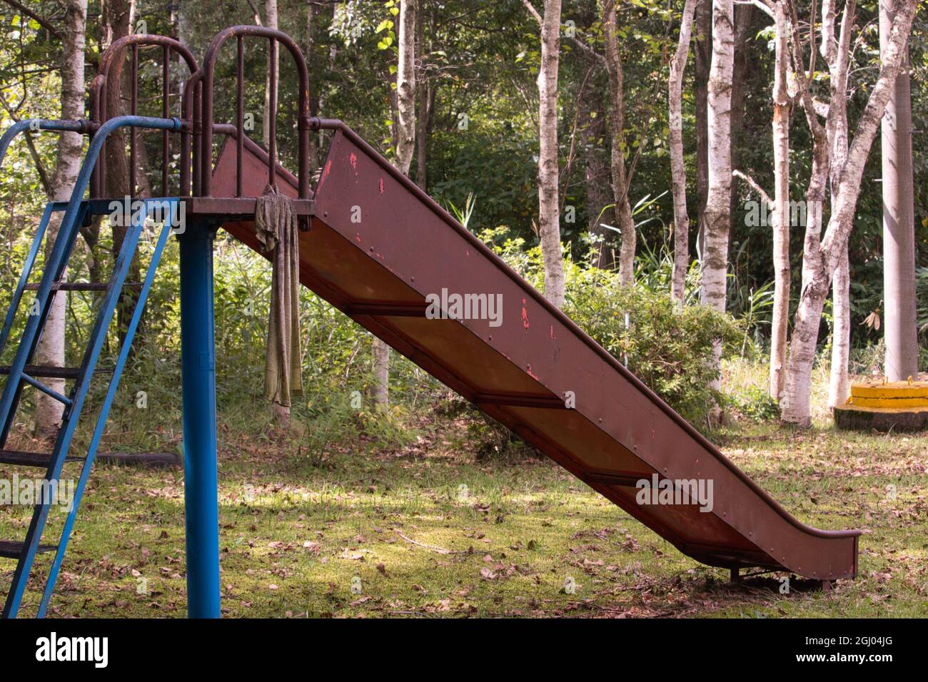 Old abandoned playground slide hi-res stock photography and images - Alamy