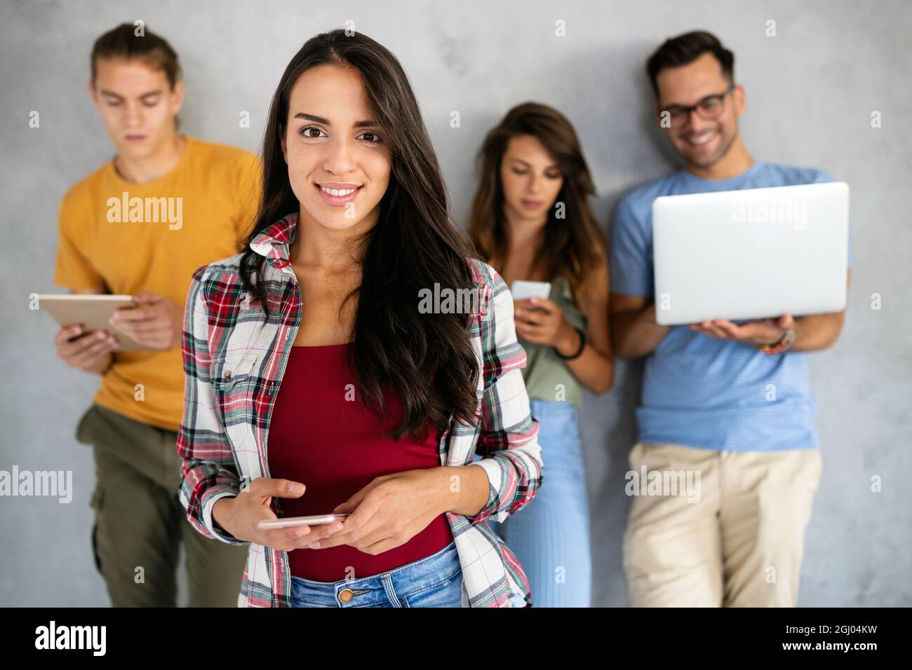Happy young people working, using digital devices. Technology, people ...