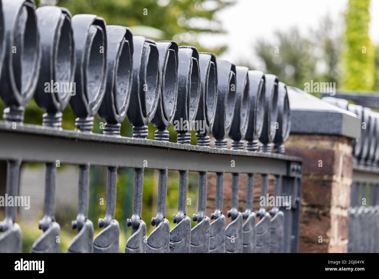 Metallic gate entrance of a park Stock Photo - Alamy